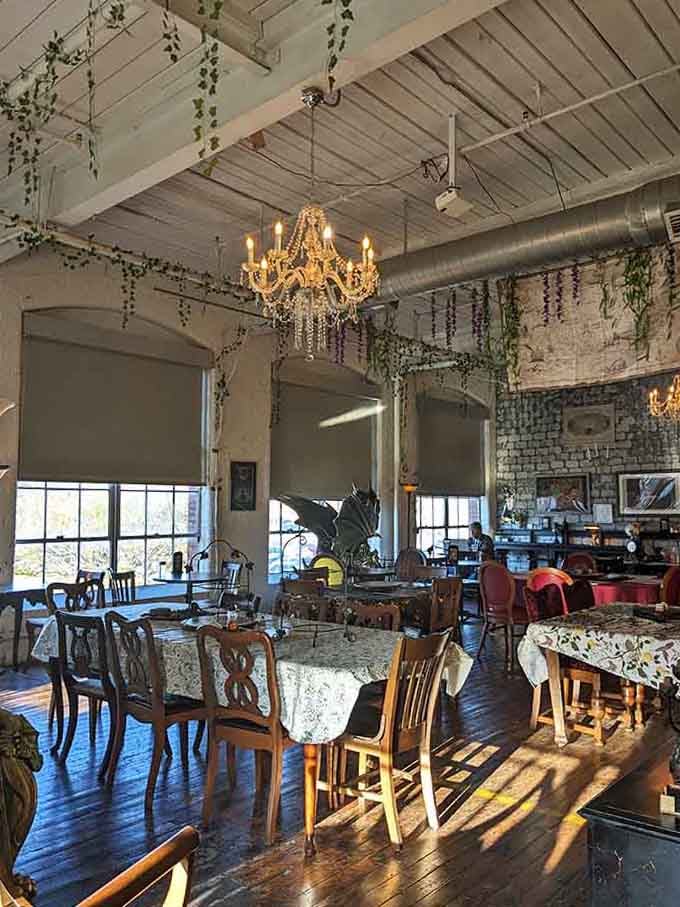 Chandeliers and cascading vines create an atmosphere that's equal parts elegant tearoom and enchanted forest hideaway.