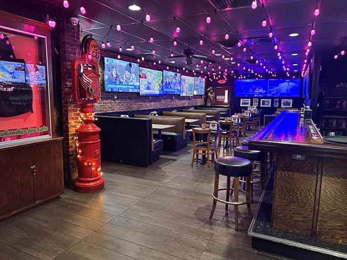 String lights and exposed brick create the perfect backdrop for serious eating, where shuffleboard meets sports bar sophistication in the best possible way.