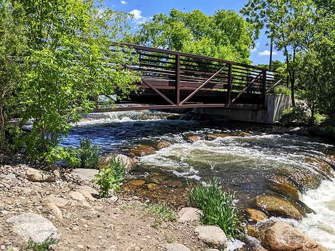 This bridge over rushing water offers front-row seats to nature's eternal performance, no ticket required.