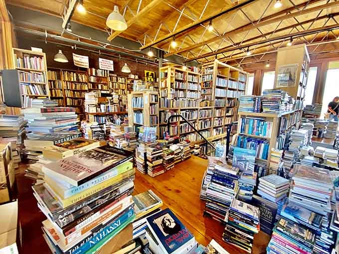 Floor-to-ceiling shelves and exposed beams create a cathedral of literature where bibliophiles come to worship properly.