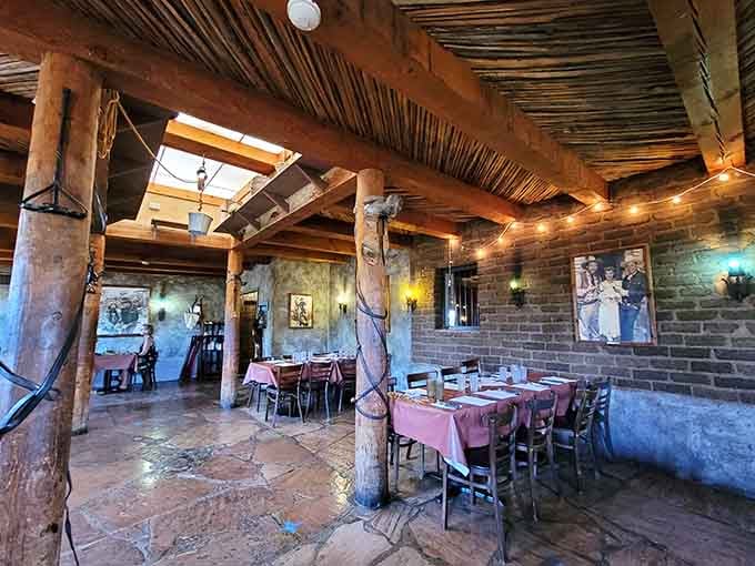 Exposed beams, brick walls, and string lights create an atmosphere where every meal feels like a special occasion.