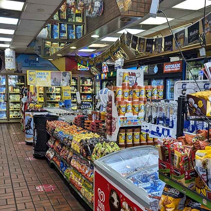 Inside, it's a sensory carnival where snack aisles and serious taco operations coexist in perfect harmony.