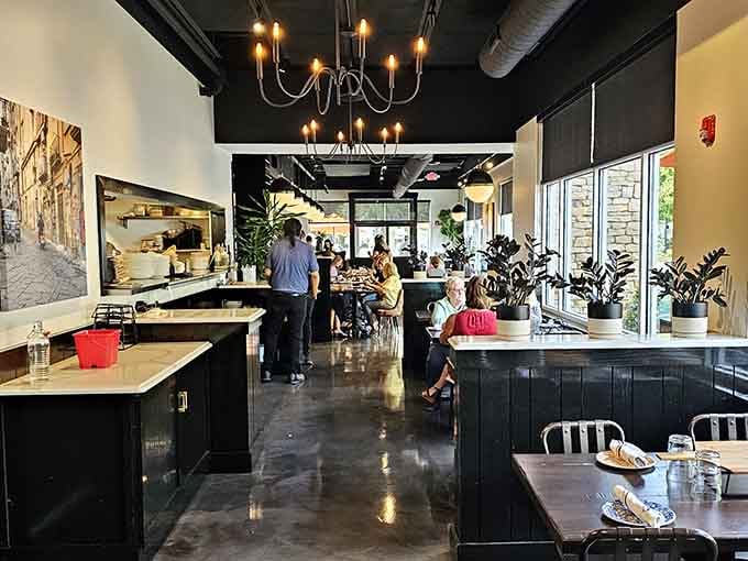 Modern industrial meets Italian warmth, where exposed ceilings and lush greenery create the perfect dining atmosphere.