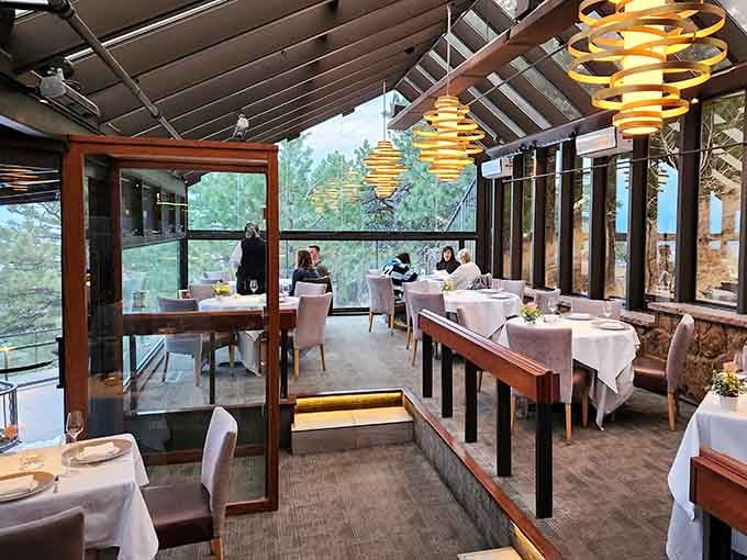 Those sculptural light fixtures aren't just d&eacute;cor, they're conversation starters hovering above your multi-course masterpiece.