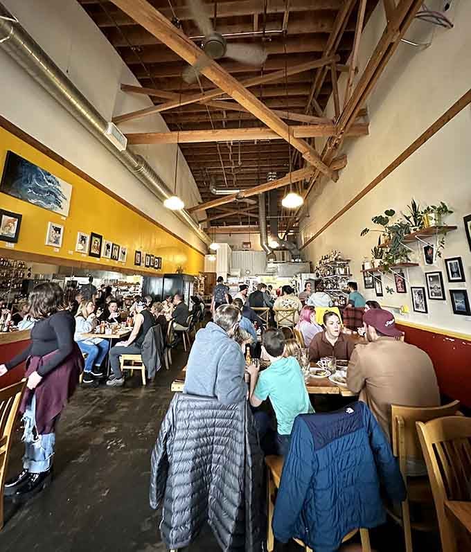 Exposed beams, yellow walls, and a packed house create the kind of energy that makes Sundays worth celebrating.