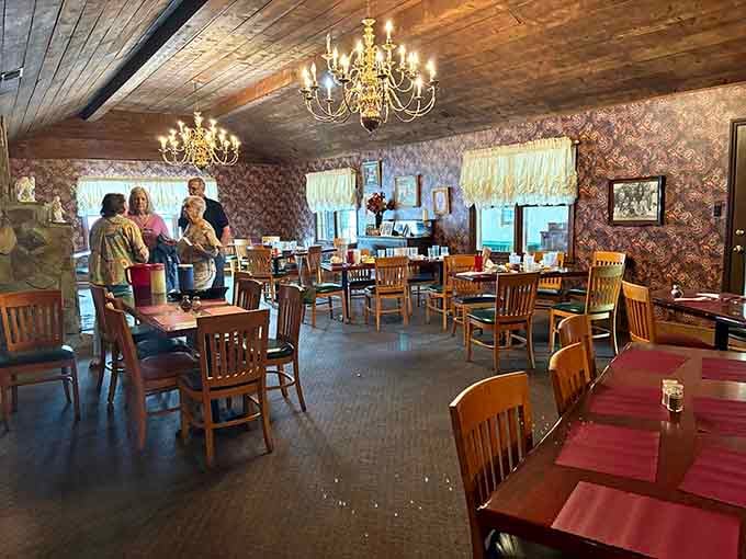 Those chandeliers hanging over simple wooden tables prove that elegance doesn't require pretension, just good taste and better food.