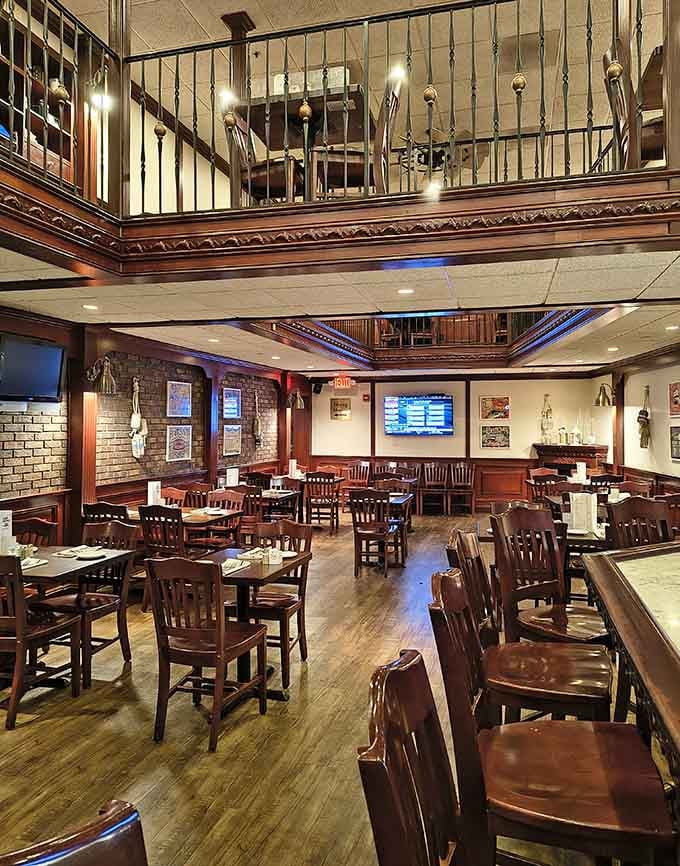 The two-level dining room creates an intimate atmosphere where serious carnivores gather for even more serious steaks.