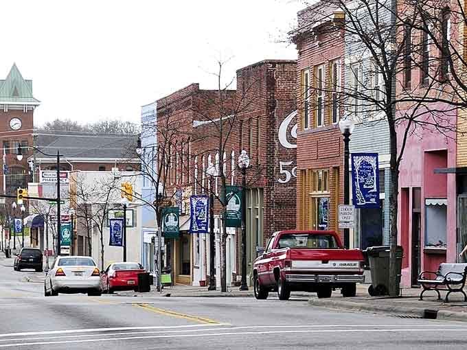 Those vintage storefronts and clock tower whisper stories of textile mills while today's boutiques keep Main Street thriving.