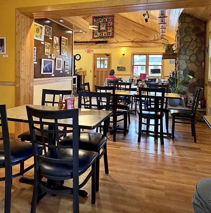Warm knotty pine walls and a stone fireplace create the cozy northwoods atmosphere where great meals happen naturally.
