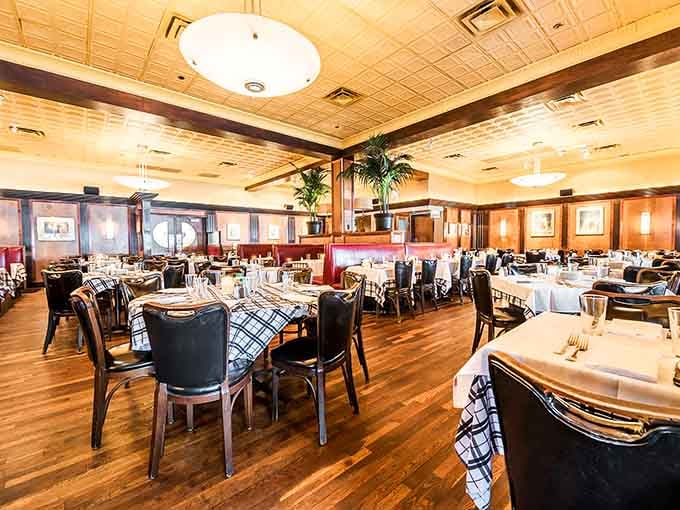 Classic elegance meets comfortable dining where white tablecloths and warm lighting create the perfect celebratory atmosphere.