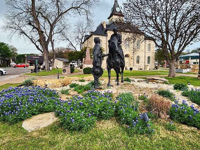 That courthouse statue and those bluebonnets create a scene so perfectly Texas, you'll swear you've seen it on a postcard.