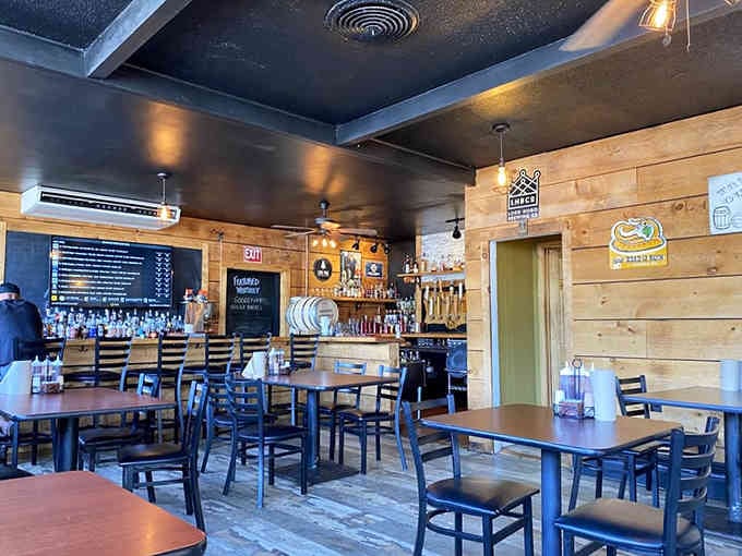 Wood-paneled walls and ceiling fans create the perfect laid-back atmosphere where ribs take center stage.