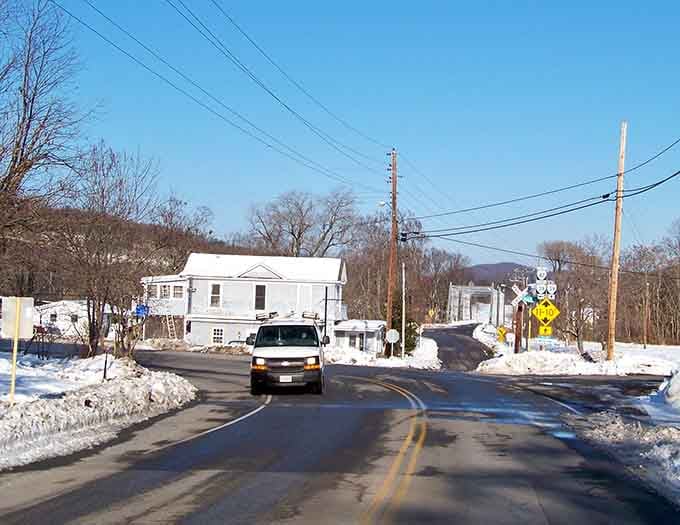 Winter transforms this valley crossroads into a postcard, complete with mountains that make you forget your troubles.