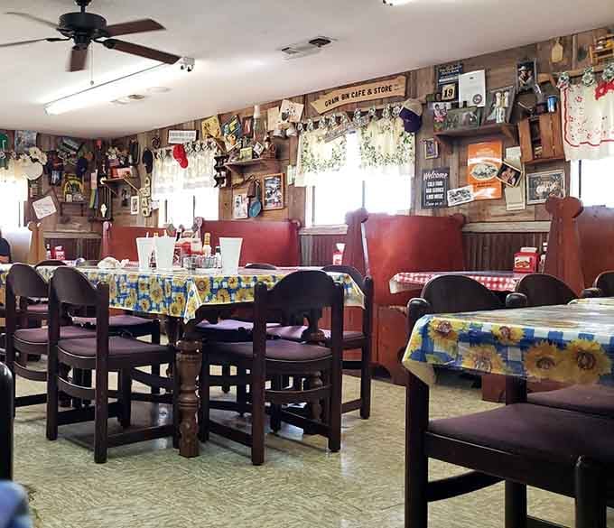 Colorful tablecloths and ceiling fans create an atmosphere where comfort food feels right at home among the memorabilia.
