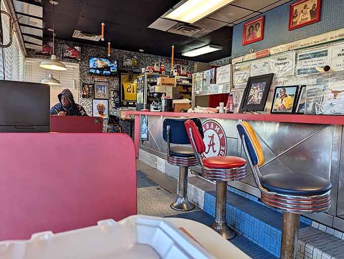 Chrome stools, red vinyl booths, and Alabama pride on every wall make this the real deal.