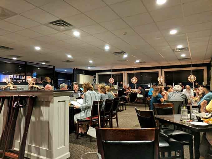 Inside, the dining room buzzes with happy diners who've discovered where locals go for serious steakhouse satisfaction.