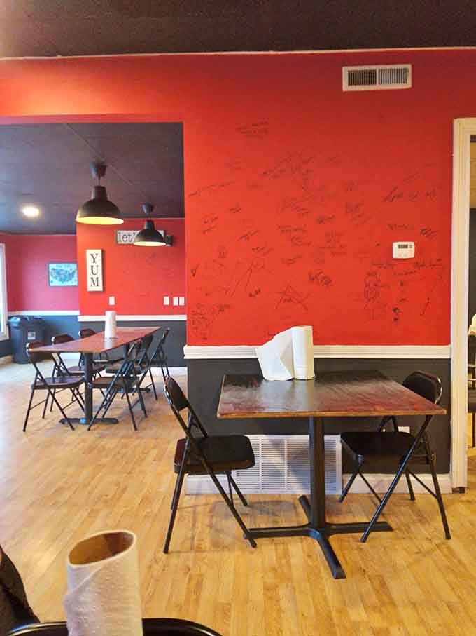Bold red walls and simple tables create the perfect no-nonsense backdrop for serious barbecue eating.