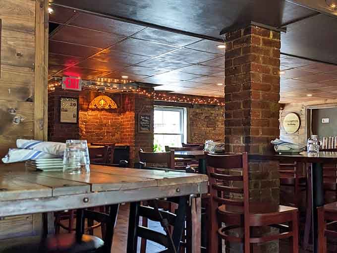 Exposed brick walls and warm lighting transform century-old cells into the coziest dining room you've ever seen.