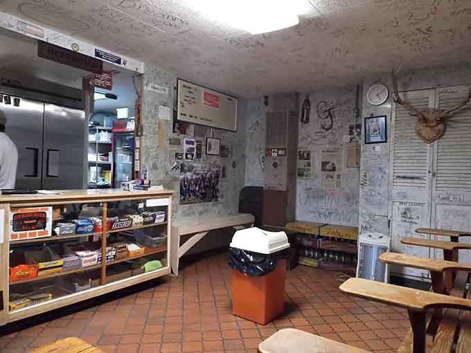 Walls covered in memories, red brick floors, and a mounted deer head watching over diners create pure nostalgia.