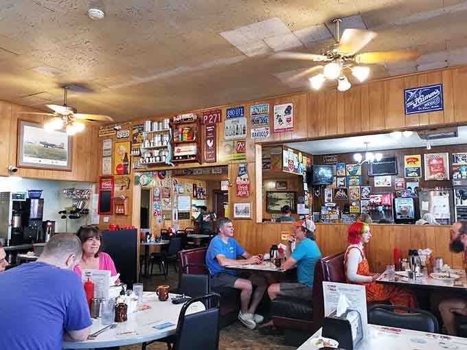 Wood paneling and vintage signs create a time capsule where the coffee's hot and the vibe's authentic.