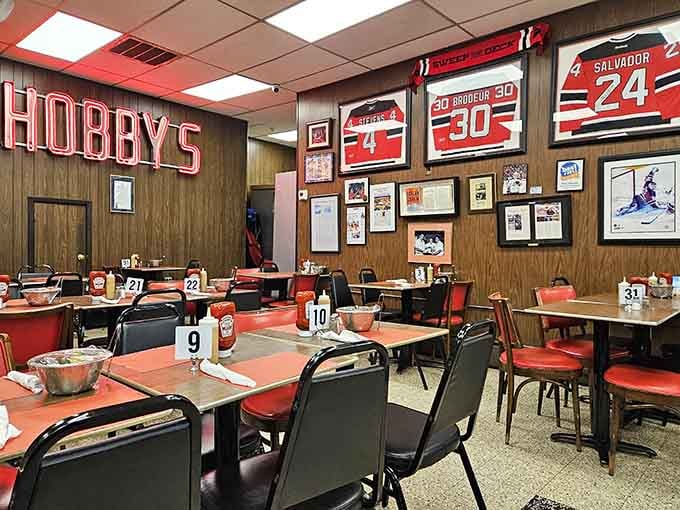 Wood paneling and Devils jerseys create the perfect backdrop for serious sandwich consumption and sports talk.