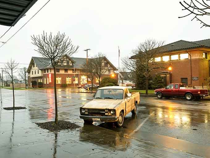 Rain-slicked streets and vintage trucks create that moody Pacific Northwest vibe you can't fake with filters.