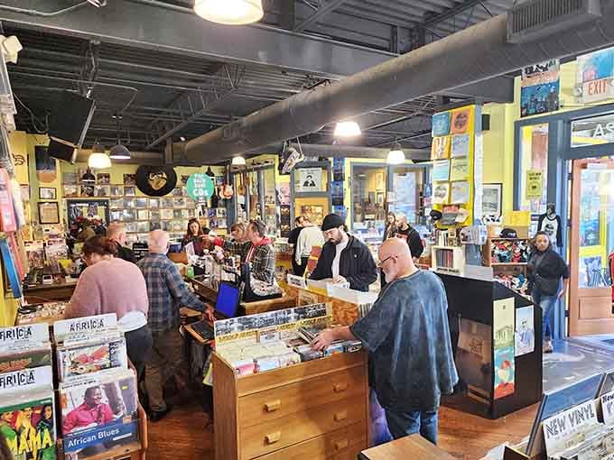 This is what music heaven looks like: wooden bins overflowing with vinyl and fellow enthusiasts on the hunt.