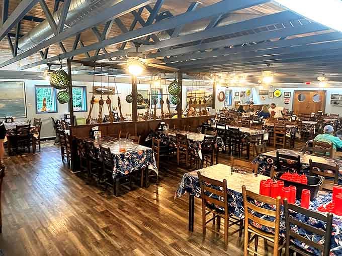 Cathedral ceilings draped with fishing nets create a dining room that feels like a ship's hull went to heaven.