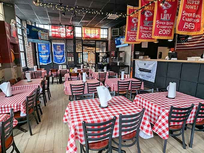 Those red-and-white checkered tablecloths and Kansas City championship banners create a Midwest vibe that feels authentically welcoming.