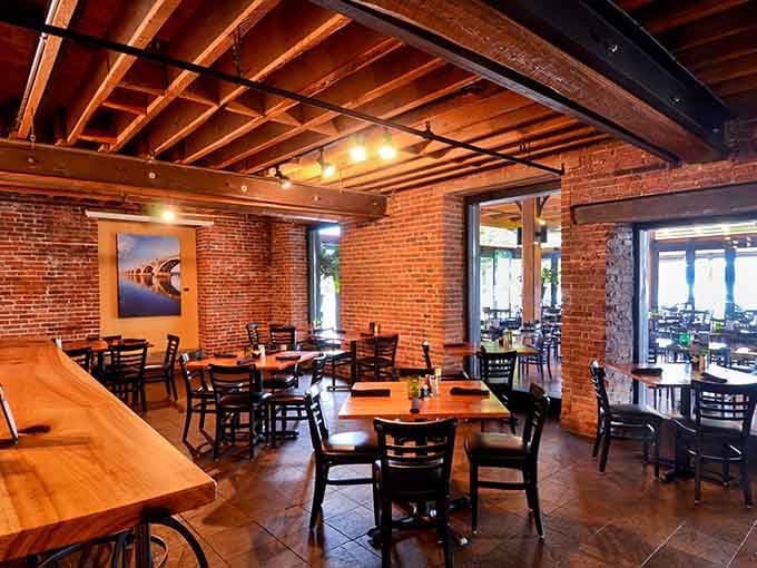 Exposed beams and brick walls that actually earned their keep before becoming your dinner backdrop.