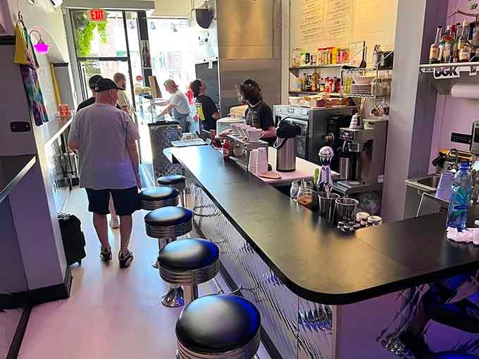 Counter seating where strangers become friends, united by their shared love of perfectly griddled pork roll perfection.