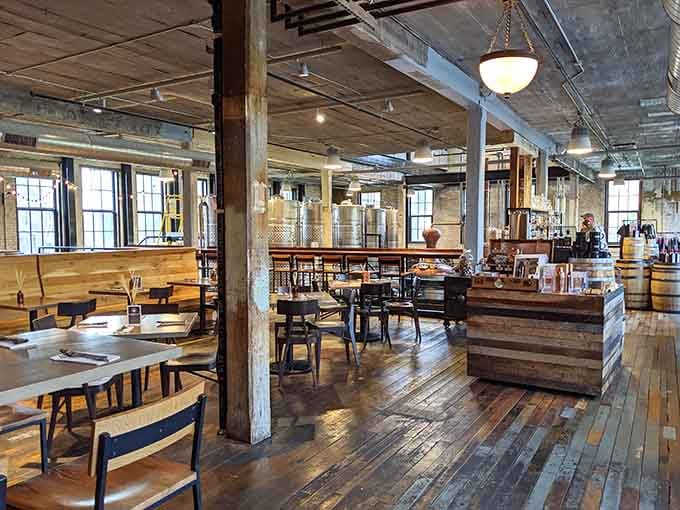 Exposed beams, natural light, and copper stills visible from your table create industrial charm without the grime.