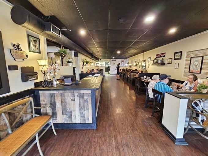 Clean lines and comfortable booths create the perfect stage for morning magic, where coffee flows and conversations linger.