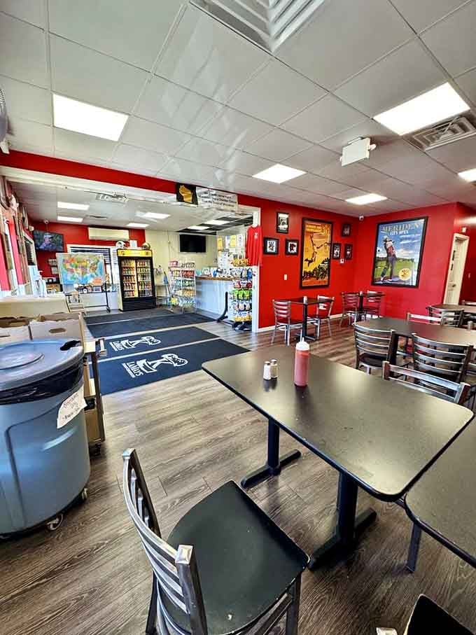 Those bright red walls aren't just cheerful, they're practically shouting that this place takes its burgers seriously without taking itself seriously.