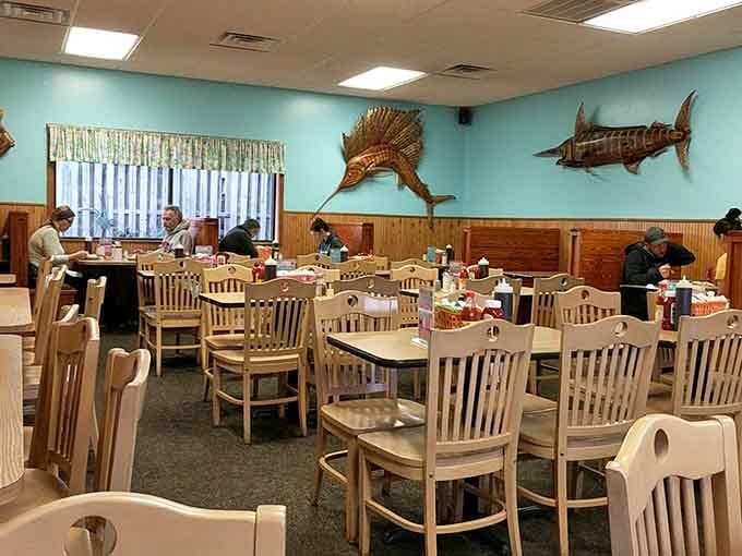 Wooden fish on turquoise walls set the scene for a meal that's pure Carolina Beach comfort.