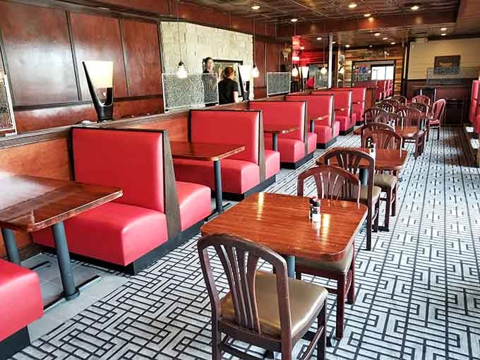 Red booths and polished wood create that classic steakhouse vibe where good things are about to happen.