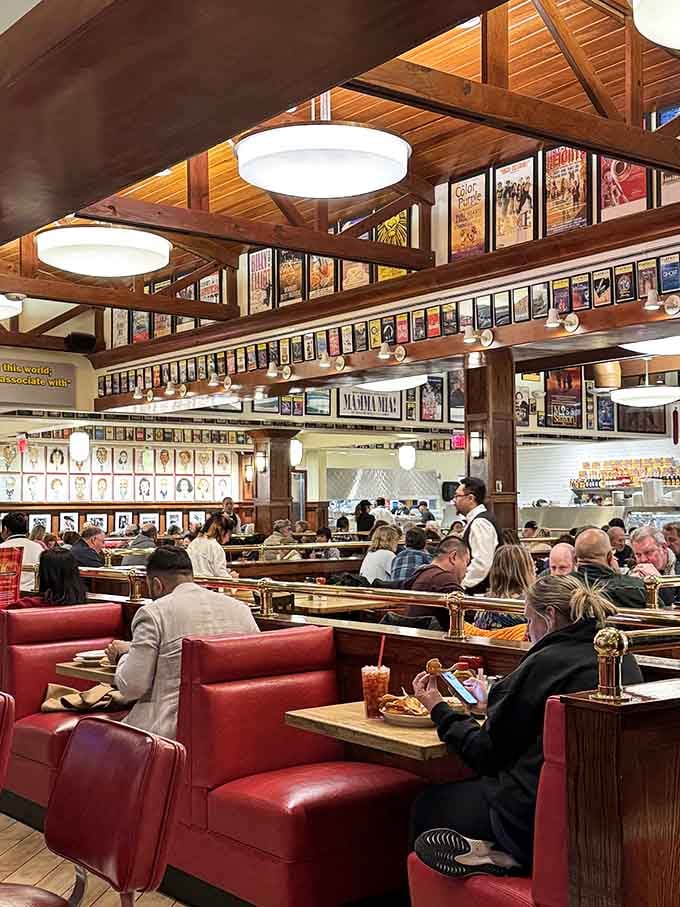 Red booths, celebrity photos, and wooden beams create the perfect backdrop for your next food coma.