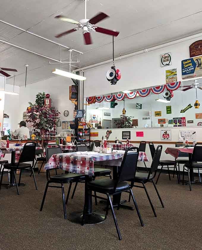 Checkered tablecloths and vintage signs create the kind of atmosphere where strangers become friends over coffee.