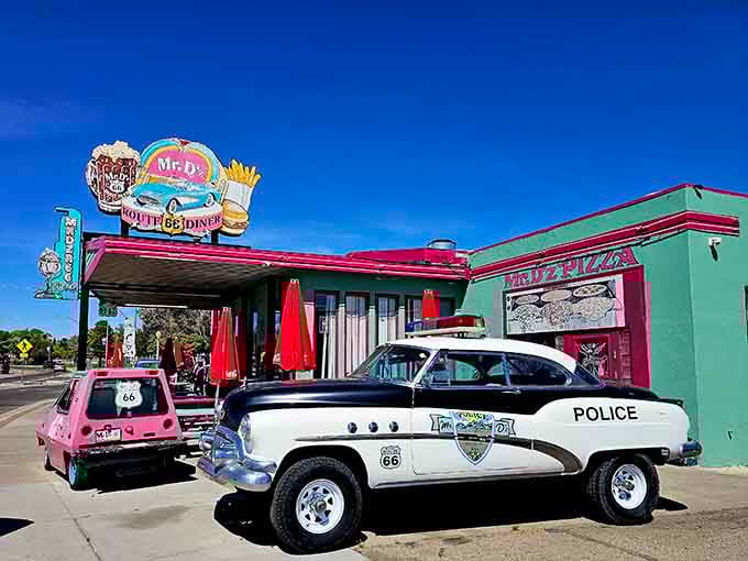 When your diner comes with its own vintage police car, you know the commitment to nostalgia is absolutely serious business.