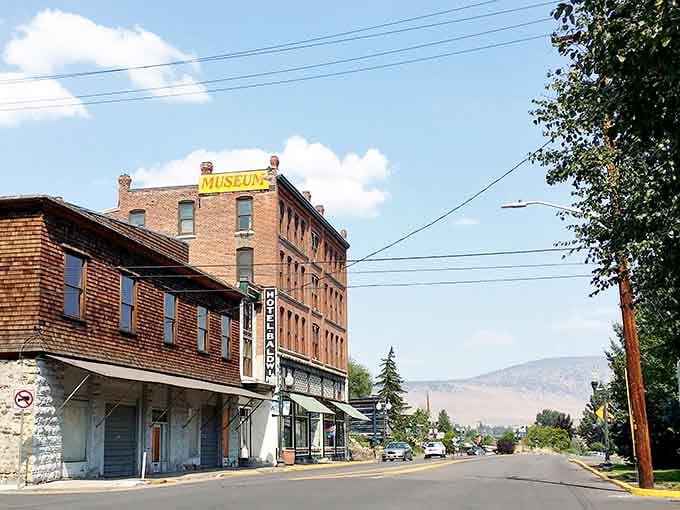 Classic brick buildings stand proud against mountain backdrops, proving small-city charm never goes out of style.