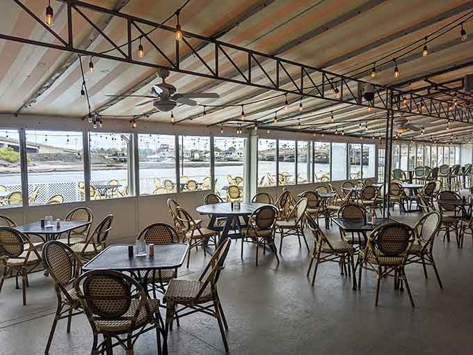 Floor-to-ceiling windows frame the river like nature's own television, broadcasting the best show in Belmar absolutely free.
