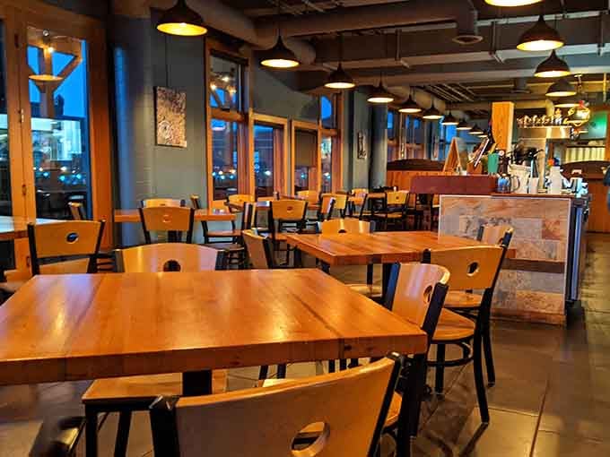 Clean lines, warm wood, and pendant lights create an atmosphere where good food feels right at home.