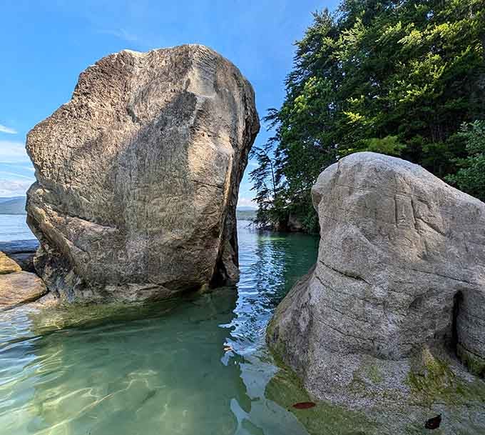 These ancient boulders frame the water like nature's own Instagram filter, except this view is completely real.