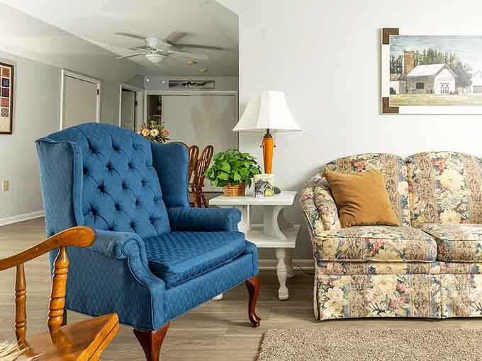Sink into that plush blue wingback chair and pretend you've been living the farm life all along.