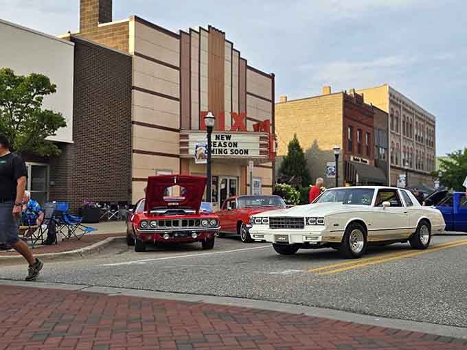 Classic cars and a vintage theater marquee remind you that some towns actually preserve their history instead of bulldozing it.