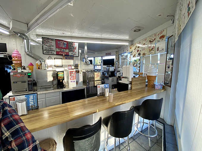 The interior counter offers front-row seats to the soft-serve symphony, where magic happens one cone at a time.