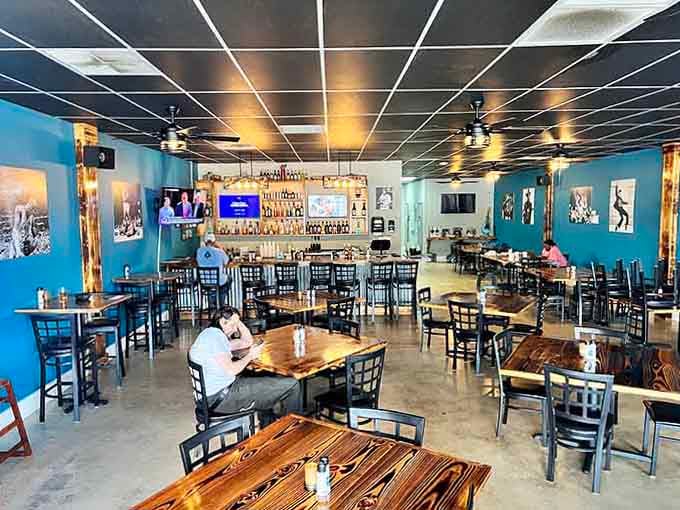 Those wooden tables and vibrant blue walls create the perfect backdrop for memories made over exceptional meals together.