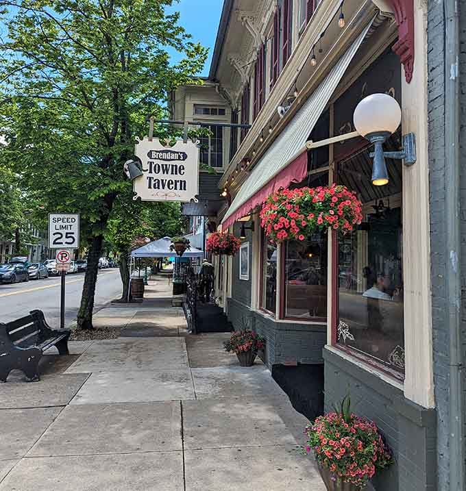 Hanging baskets and globe lights frame Brennan's Towne Tavern, where pub fare meets small-town hospitality perfectly.