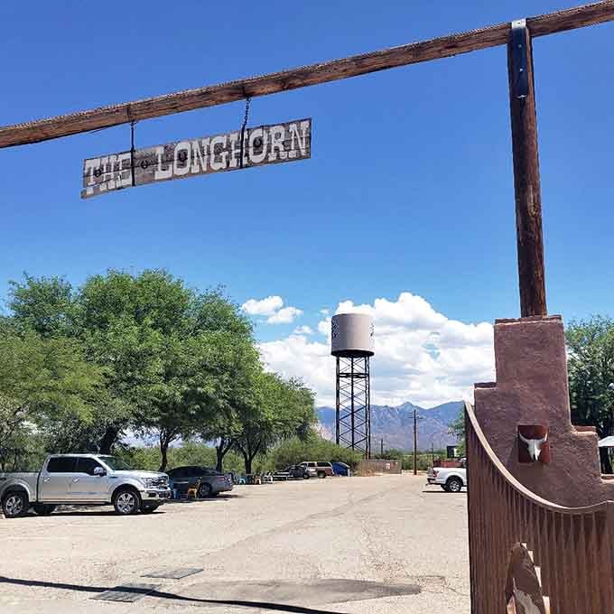 The Longhorn sign hanging proud against Arizona's endless blue sky, calling hungry travelers home since way back when.