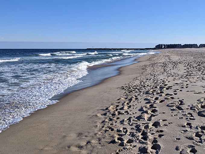 Pristine sand stretches endlessly where footprints tell stories and the Atlantic whispers secrets only beachcombers understand.